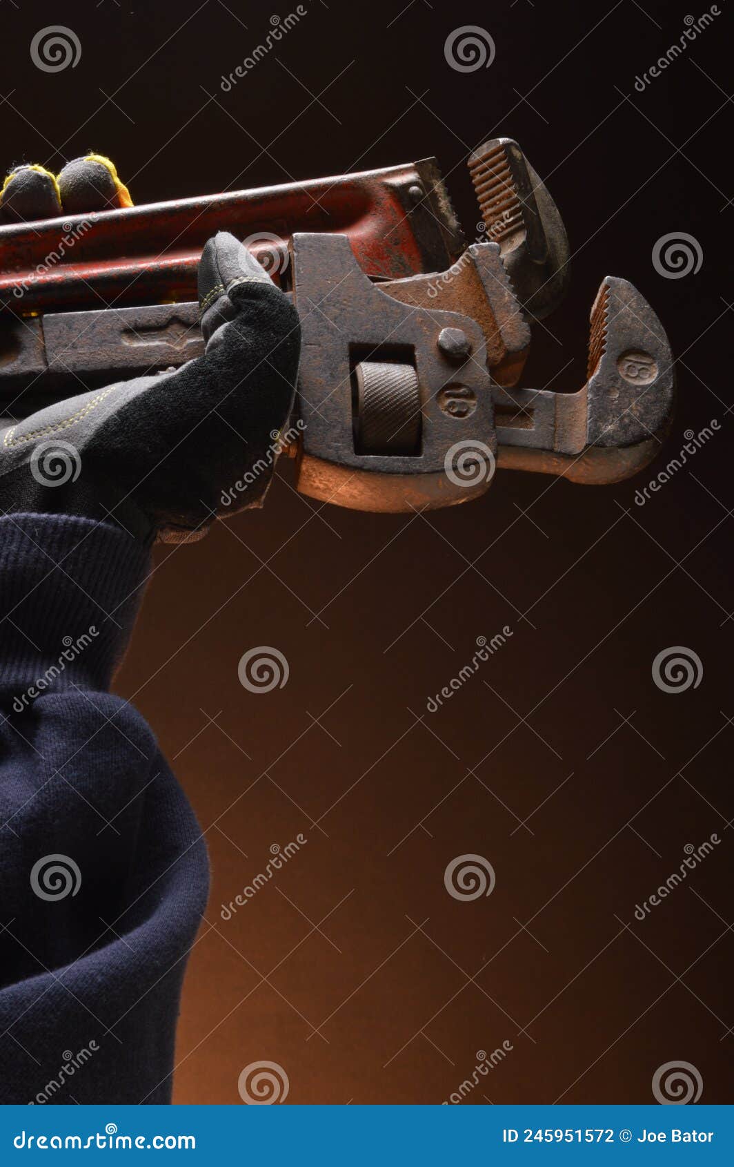 Pipe Wrenches in Hand of Workman Stock Photo - Image of spanner ...