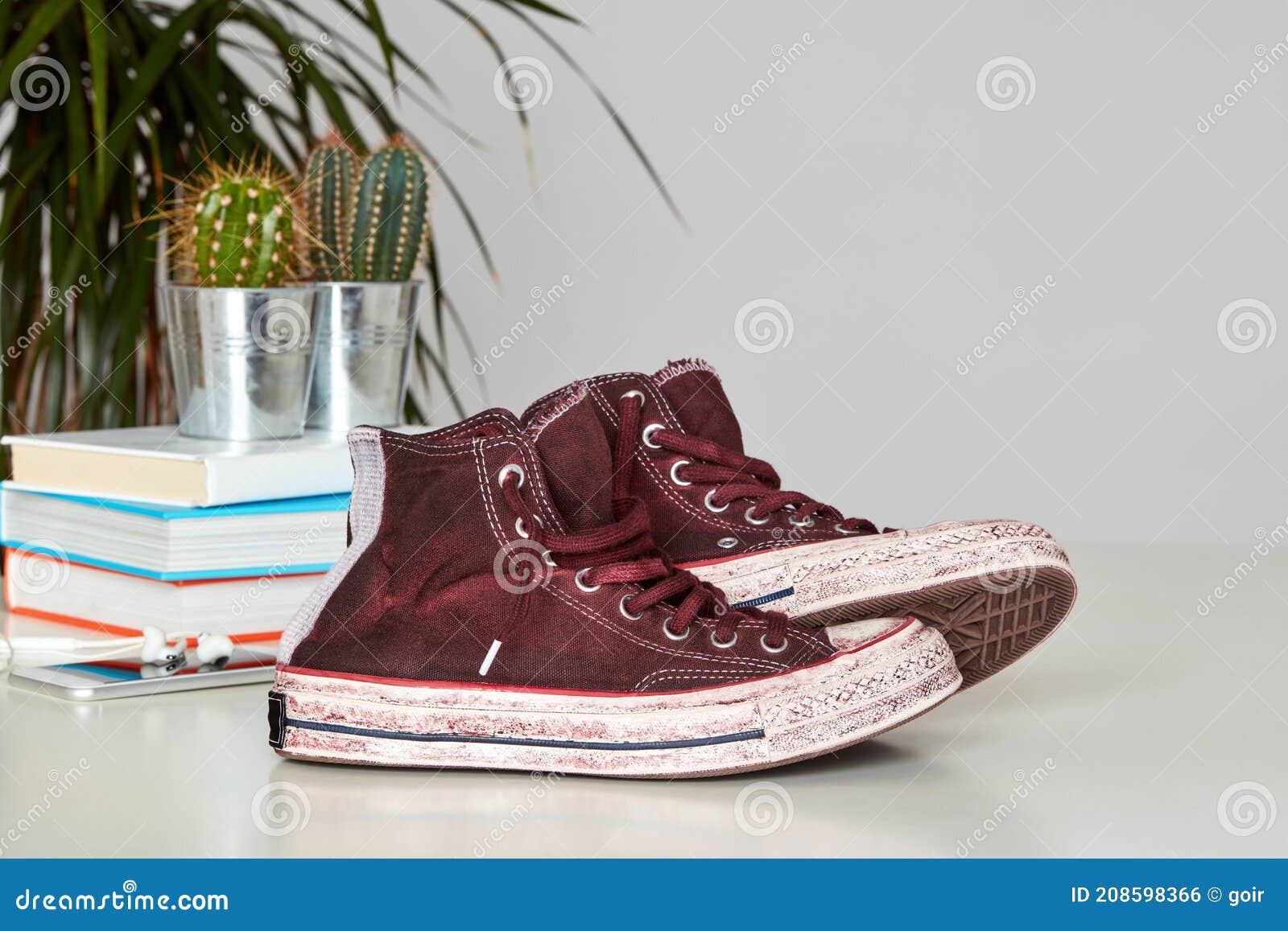 Canvas sneakers on table stock photo. Image of manufactured - 208598366