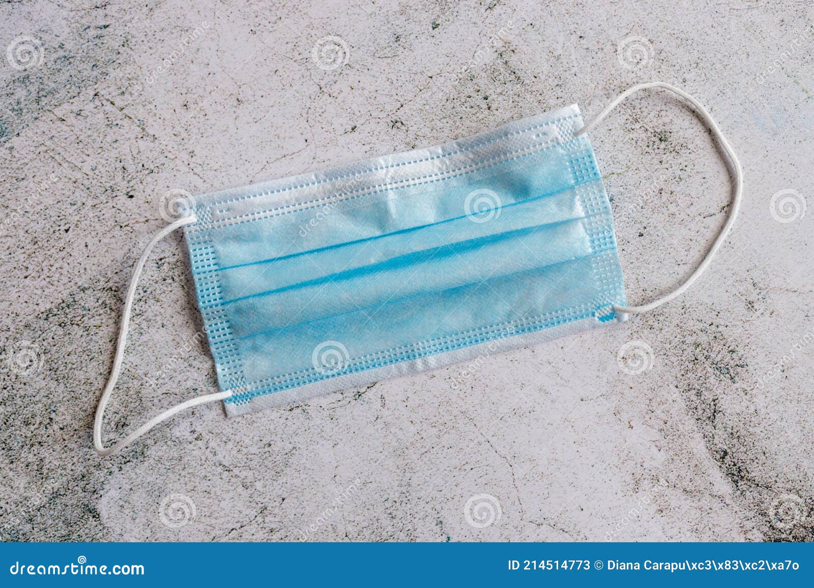 Used Surgical Face Mask Isolated on Concrete Floor Stock Image - Image ...