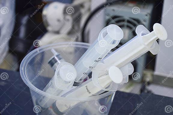 Used Syringes Put in a Clear White Container Stock Photo - Image of ...