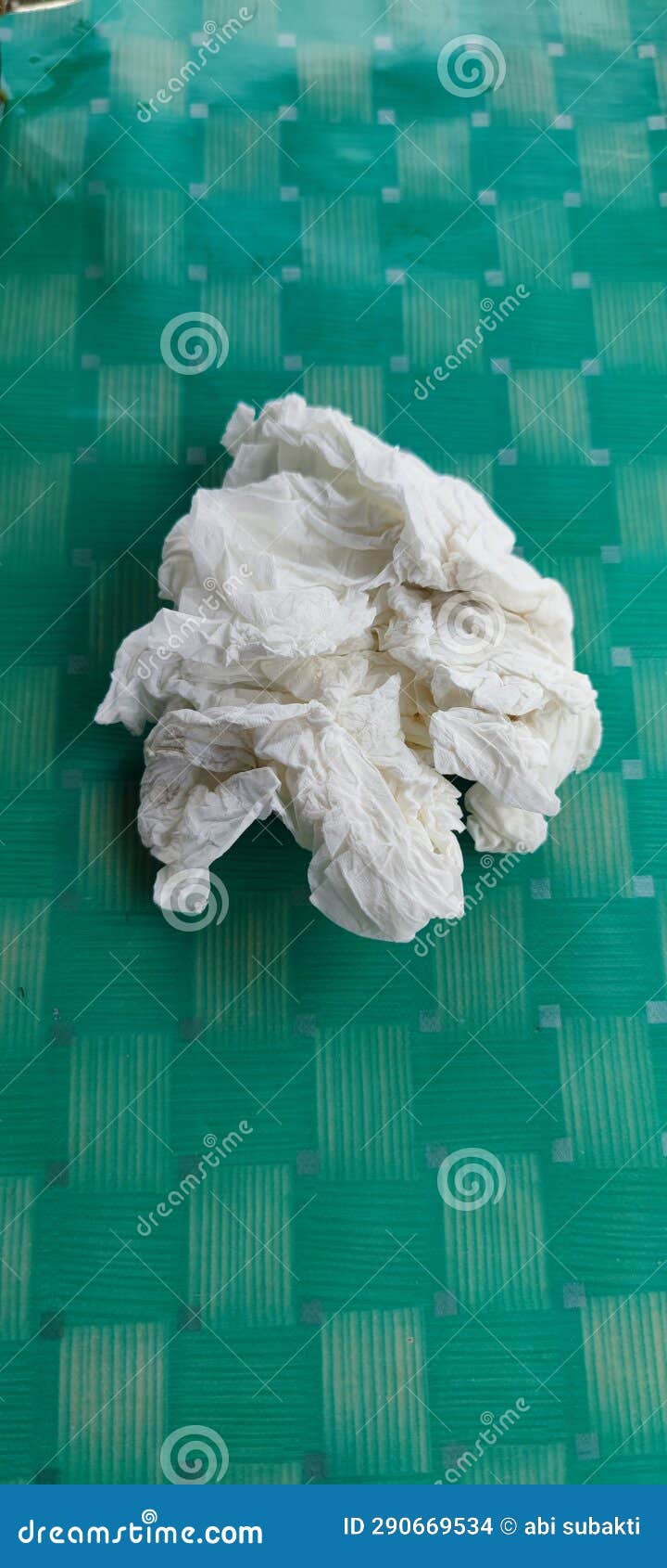 The USED TISSUE WAS USED and WAS on a GREEN TABLE Stock Photo - Image ...