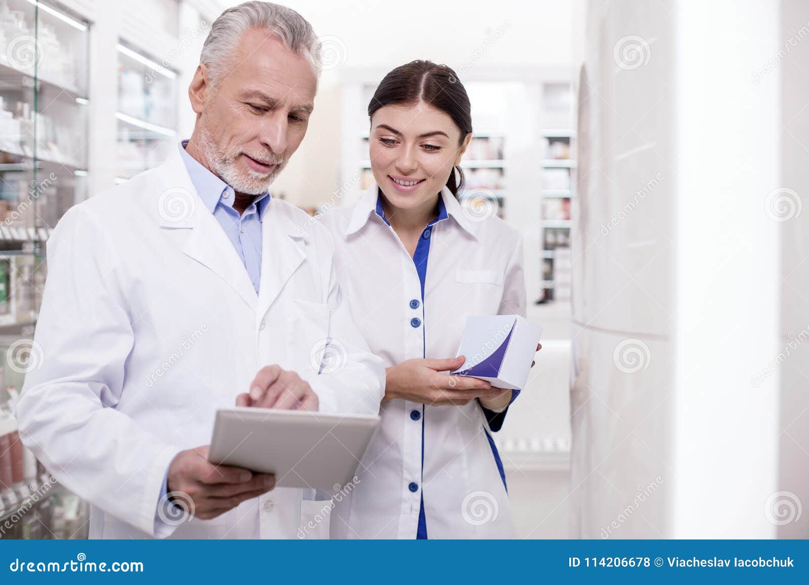 Cheerful Two Pharmacists Cooperating Stock Photo - Image of market ...