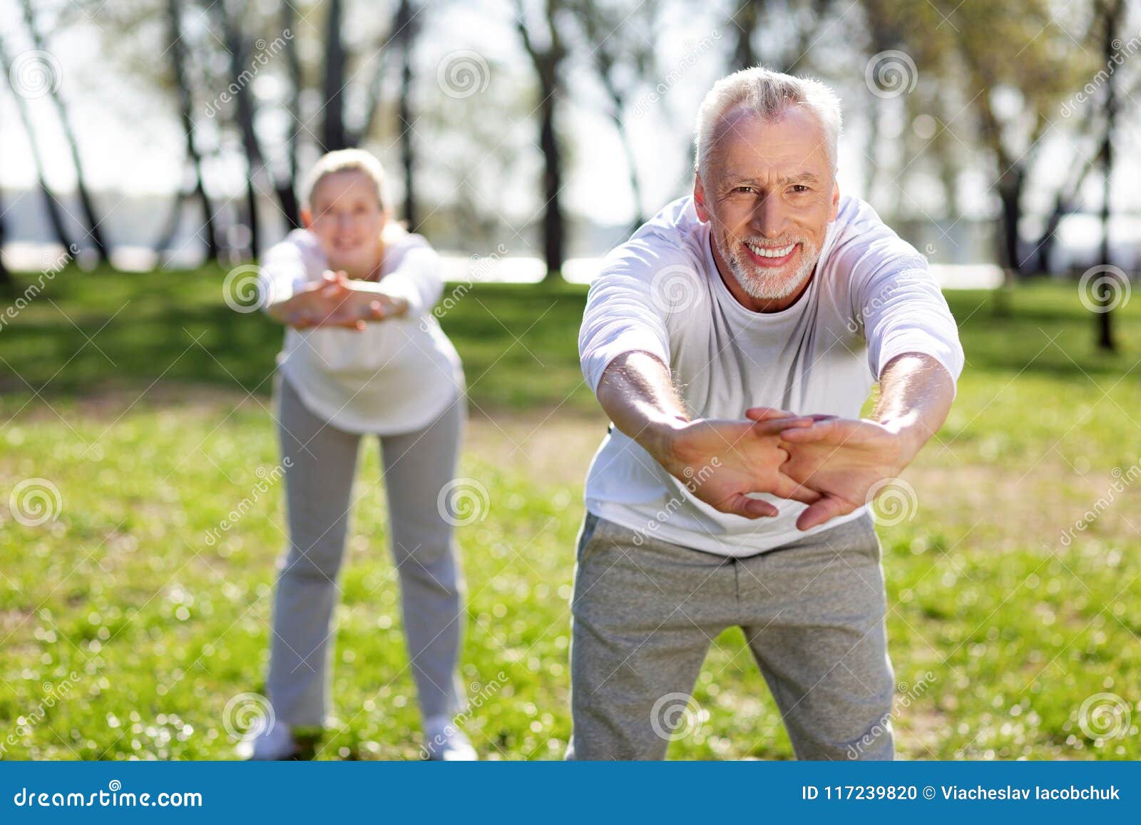 Cheerful Aged Man Leaning Forward Stock Photo - Image of male, outdoors ...
