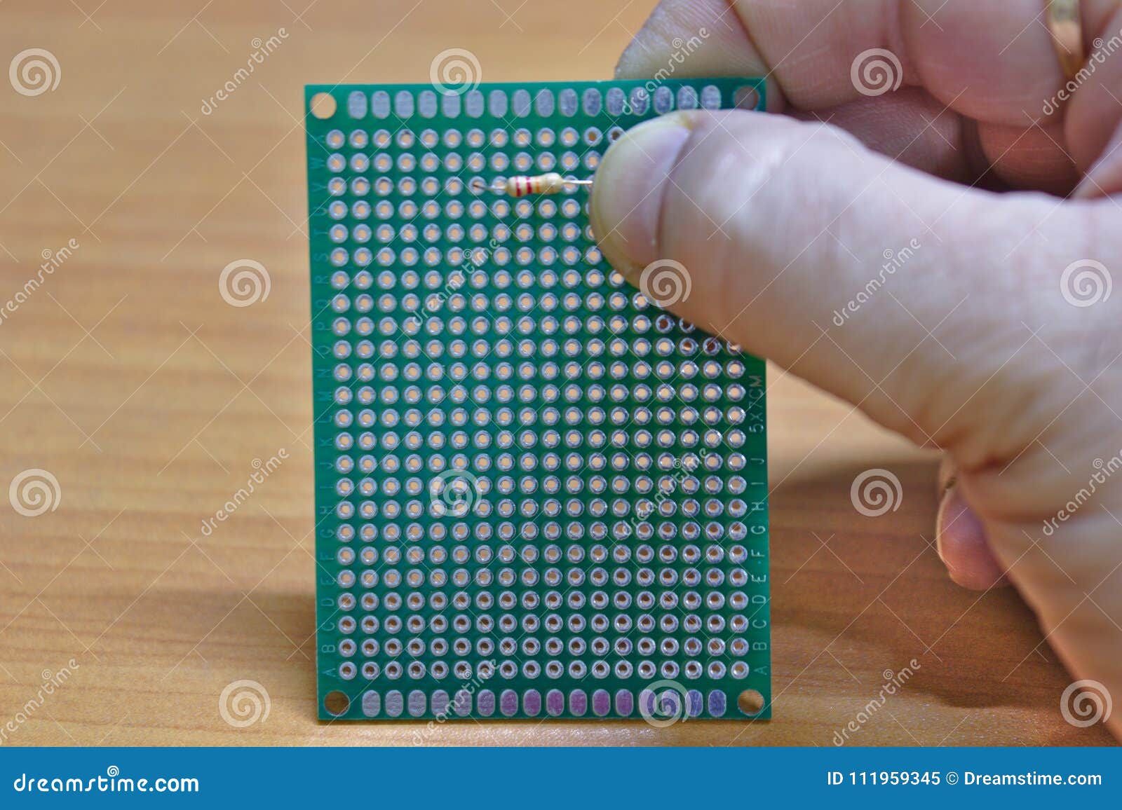 A User Mounting a Resistor on a Protoboard Stock Image - Image of board ...