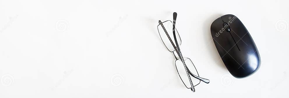 The User`s Computer Mouse and Glasses Lie on a White Surface. Research ...