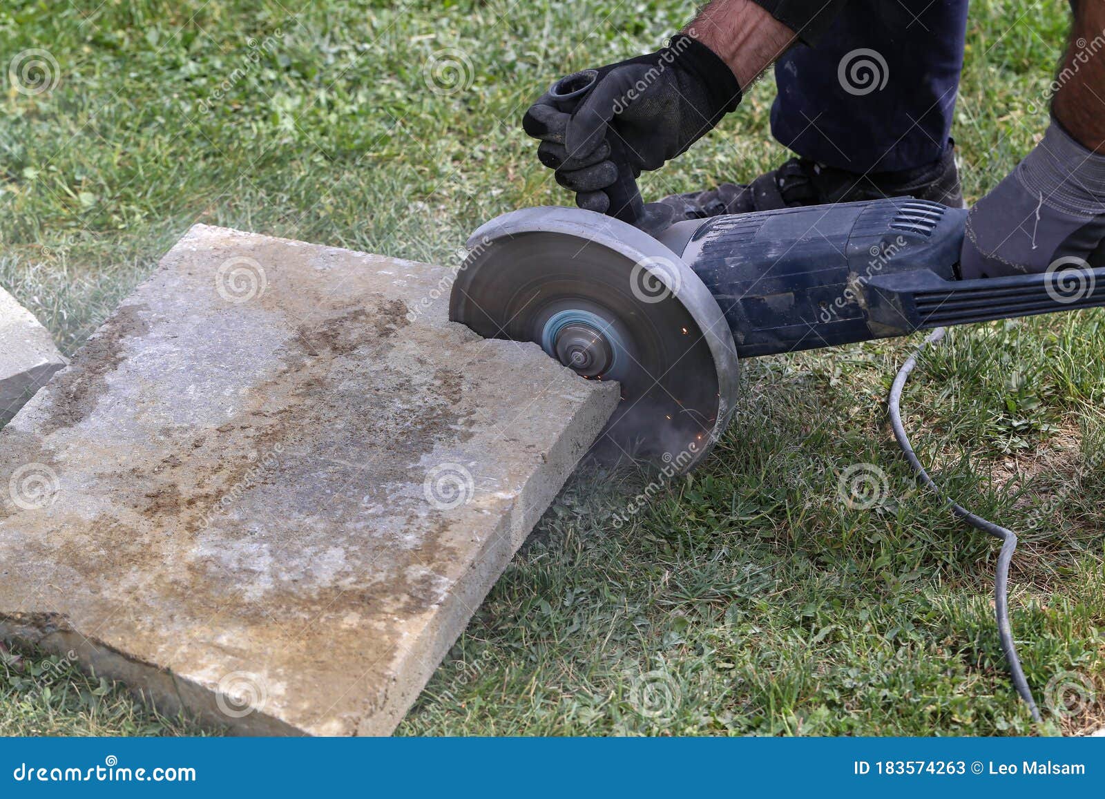 Industrial Construction Worker Using a Professional Angle Grinder Stock ...