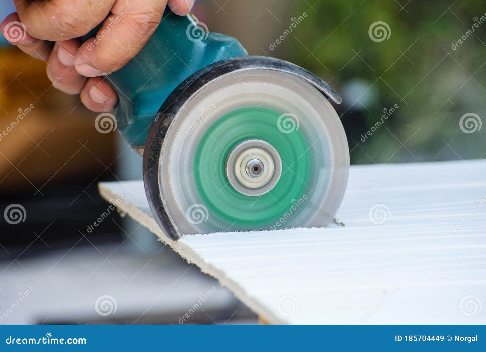 Using the angle grinder stock image. Image of cutter - 185704449