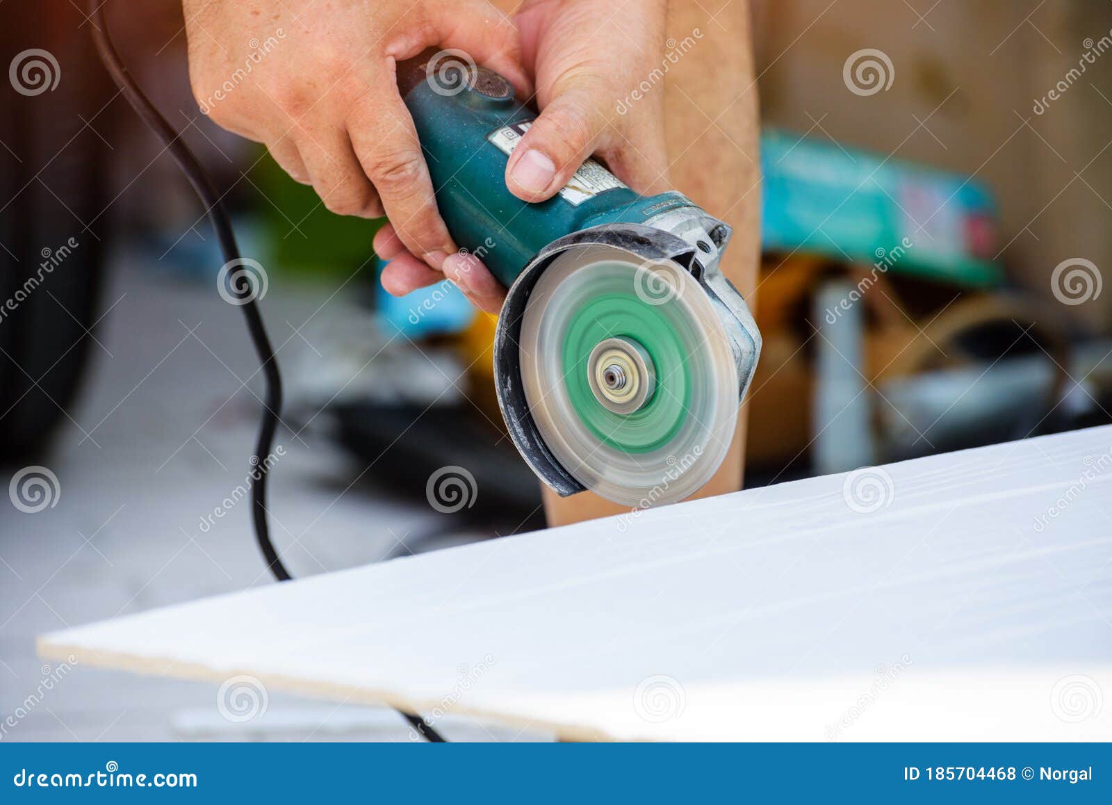 Using the angle grinder stock photo. Image of skill - 185704468