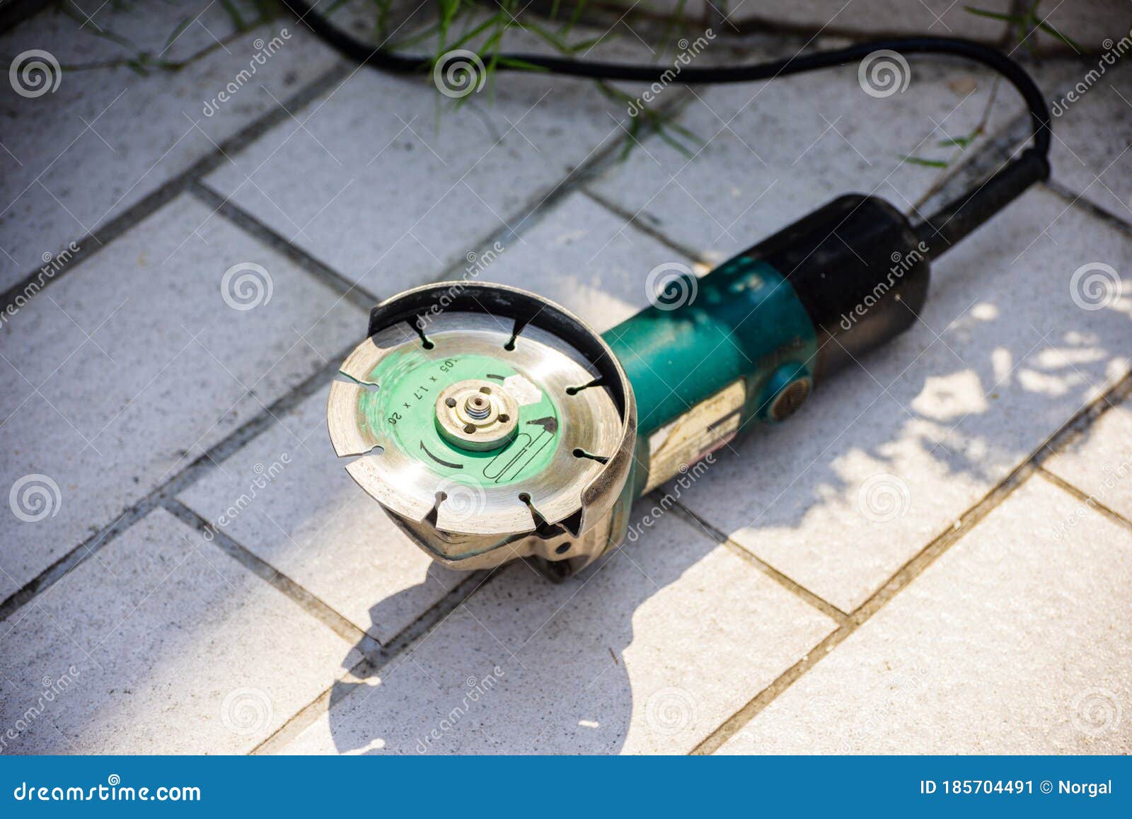 Using the angle grinder stock image. Image of construction - 185704491
