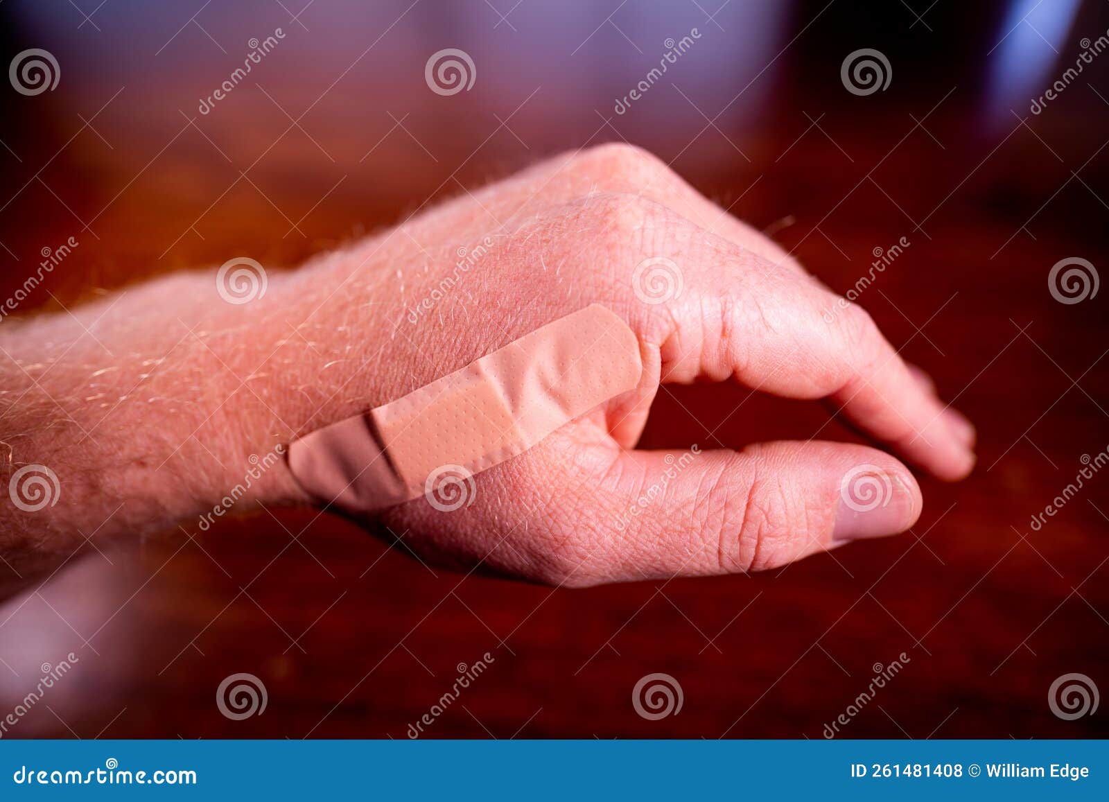 Using a band aid on a hand stock photo. Image of pain - 261481408