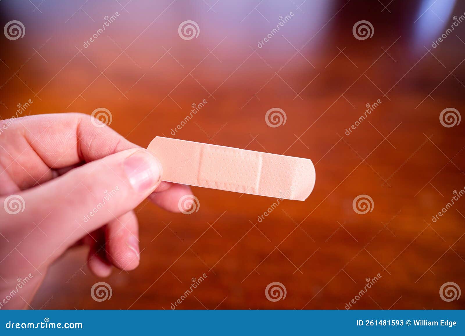 Using a band aid on a hand stock image. Image of firstaid - 261481593