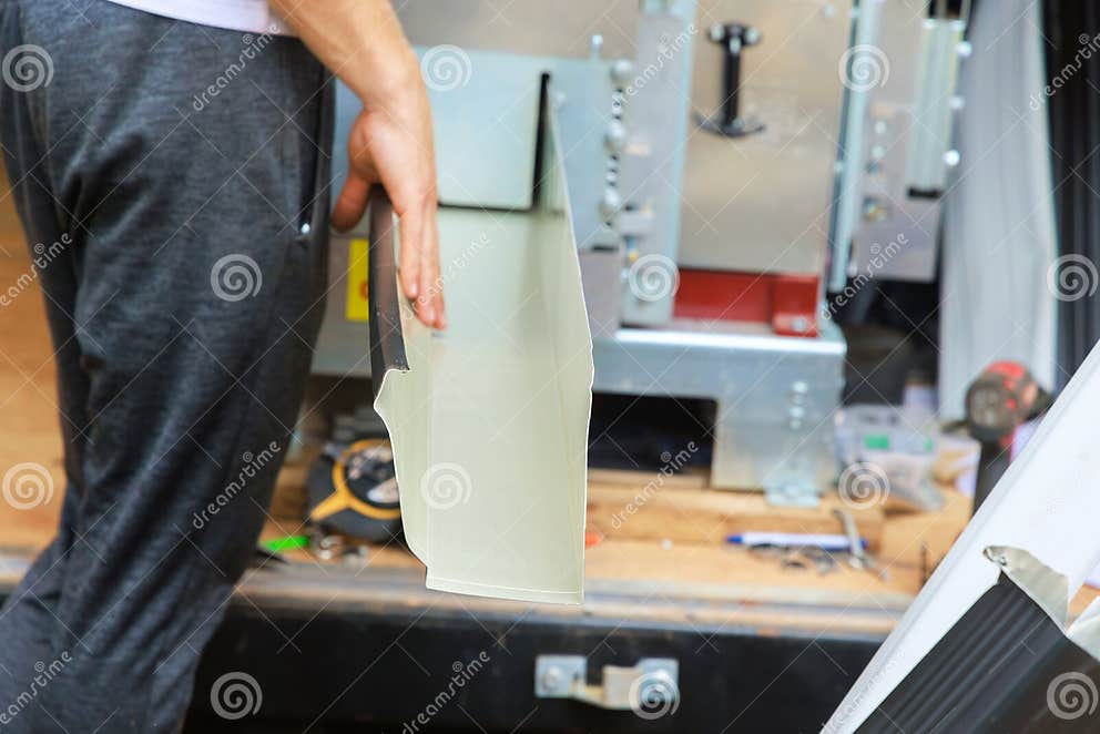 Using a Bending Machine Tool, Thin Metal Rain Gutters May Be Bent Stock ...