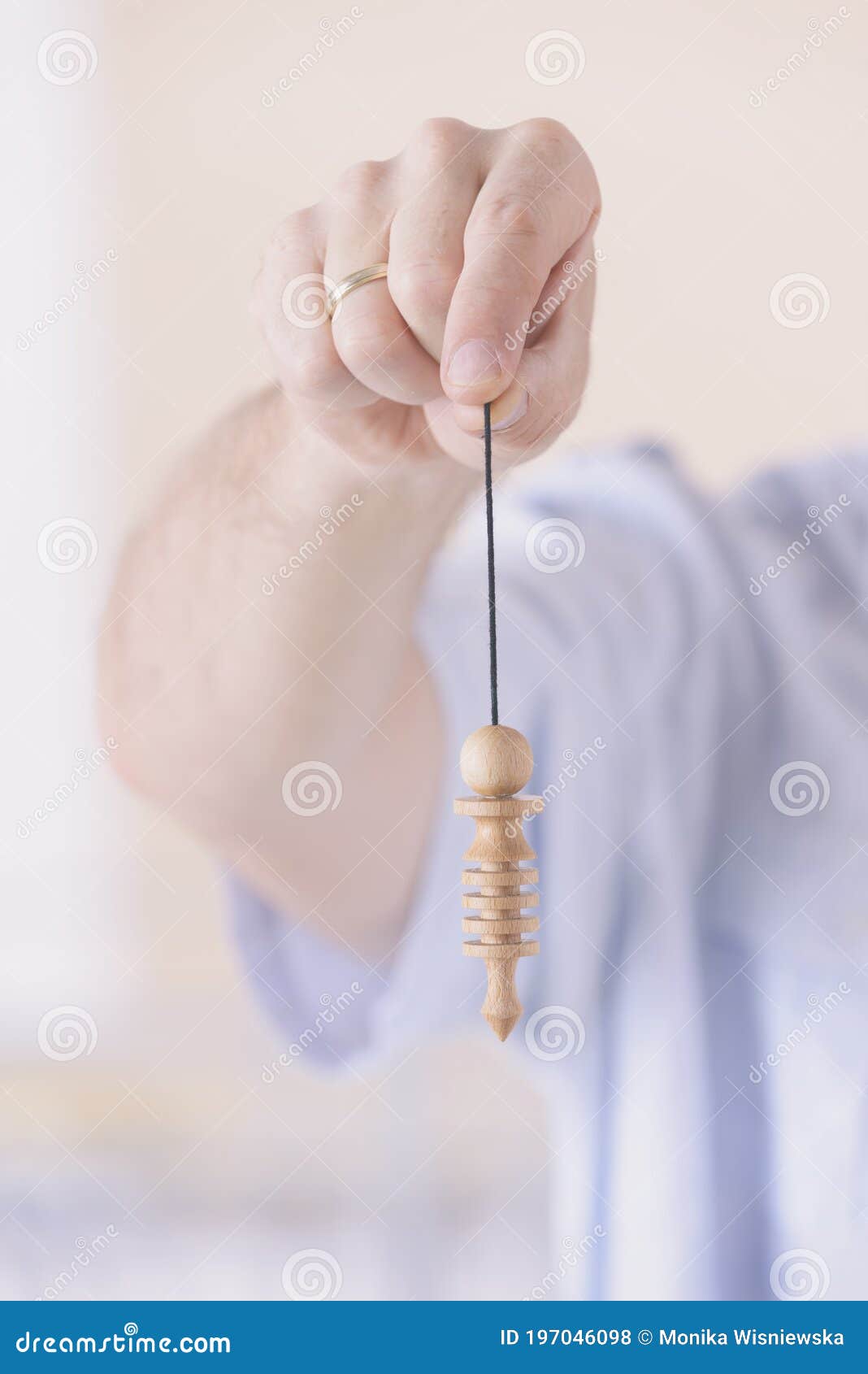 Using big wooden pendulum stock photo. Image of mystery - 197046098