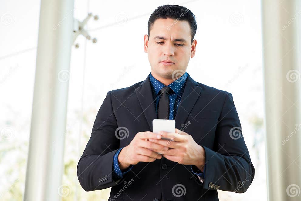 Using a cell phone at work stock image. Image of social - 47880539