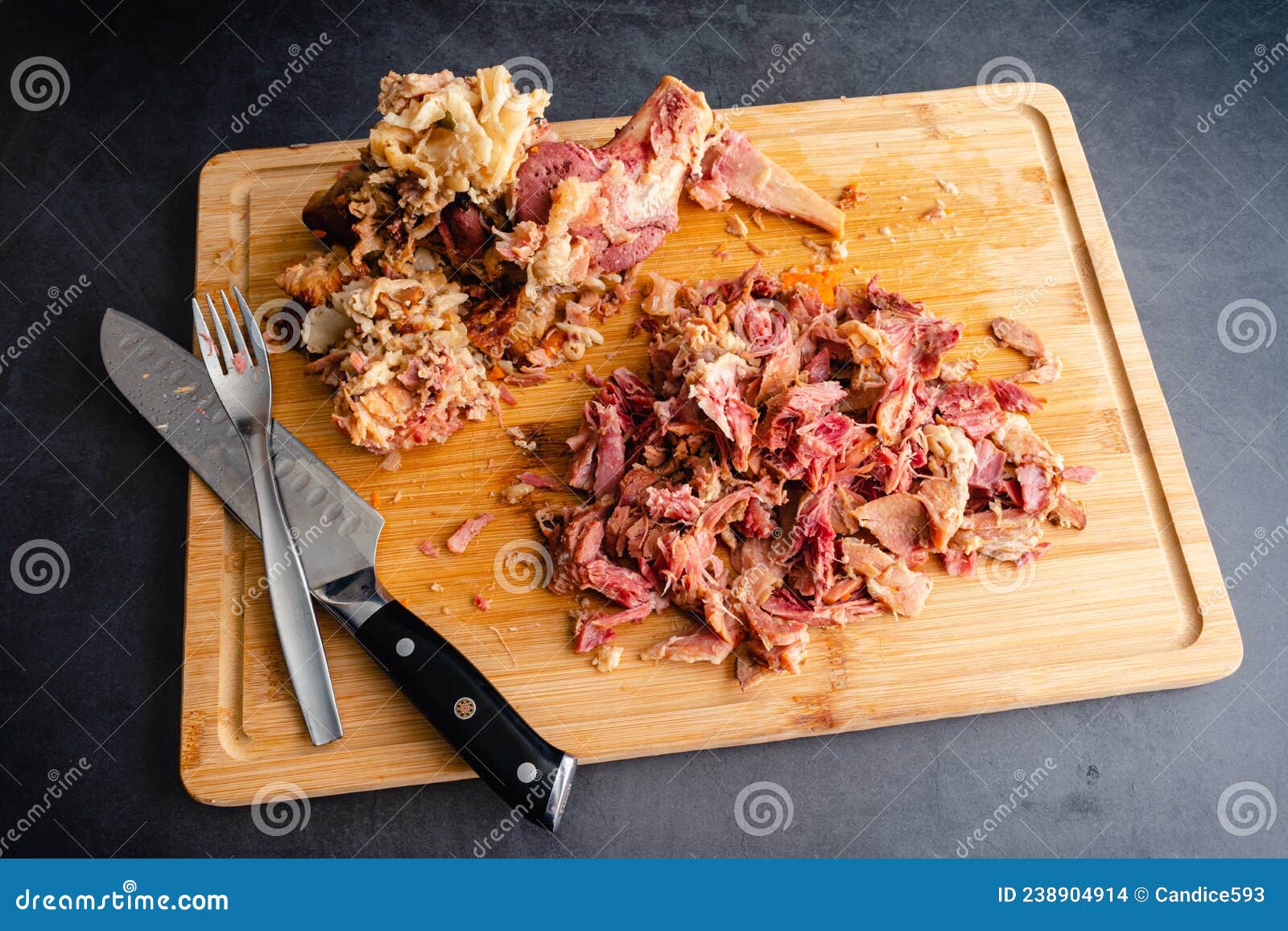 Removing Meat from a Boiled Ham Bone Stock Photo - Image of board, chef ...