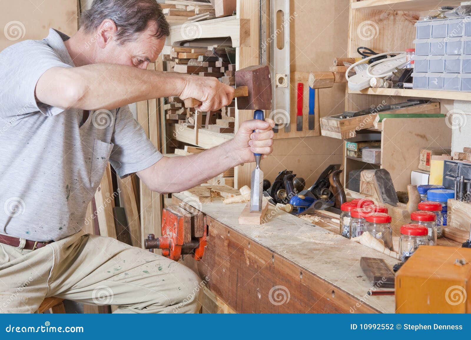 Using chisel on workbench stock photo. Image of sitting - 10992552