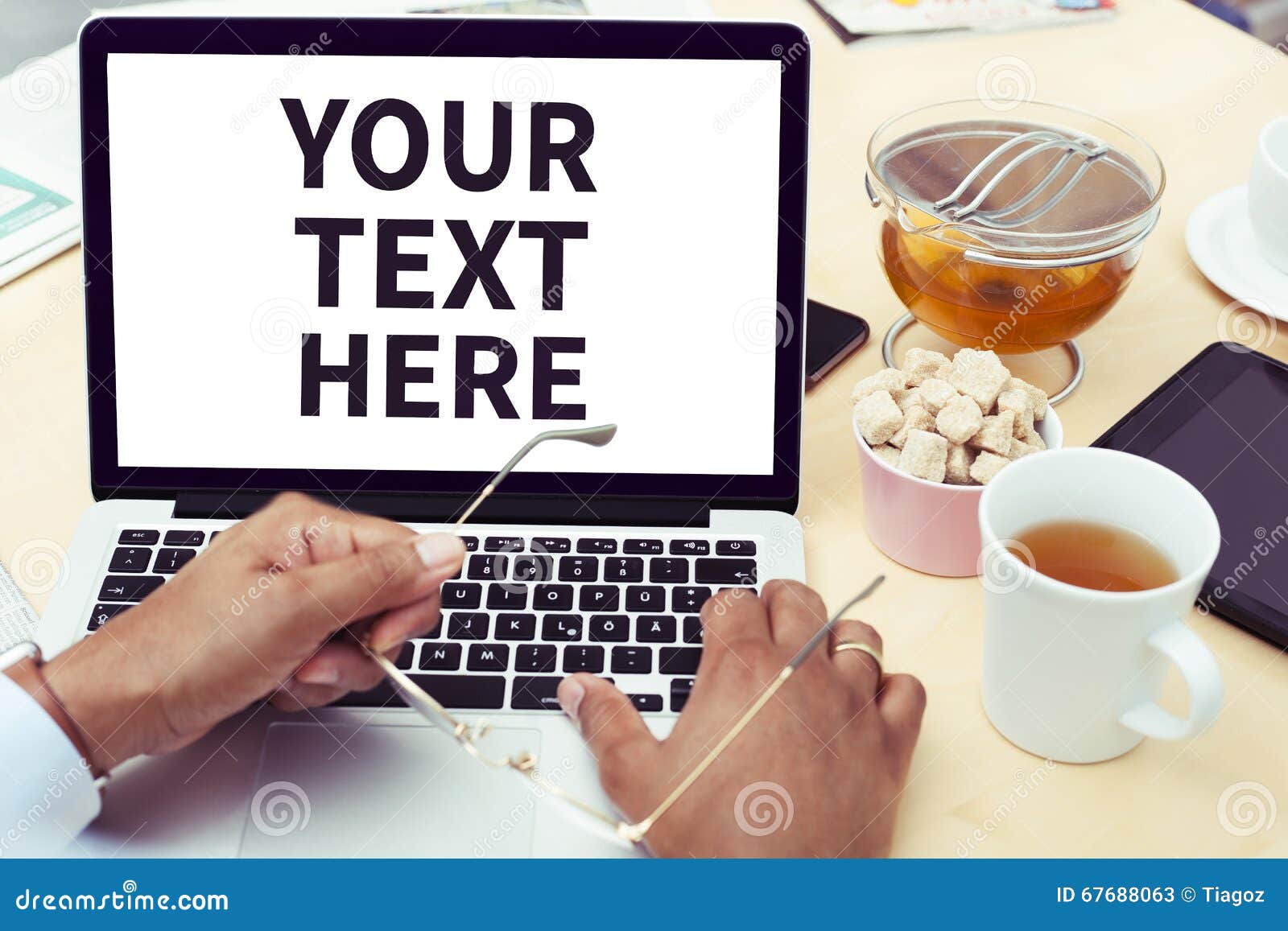 Using a Computer while Drinking Tea Stock Image - Image of people ...