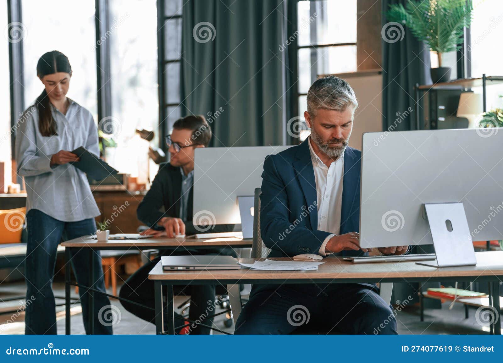 Using Computer. Group of Business People are Working in the Modern ...