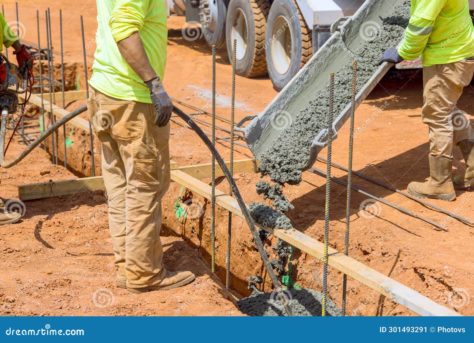A Worker Compacts Soil Or Sand With A Vibrating Plate In A Trench At A ...