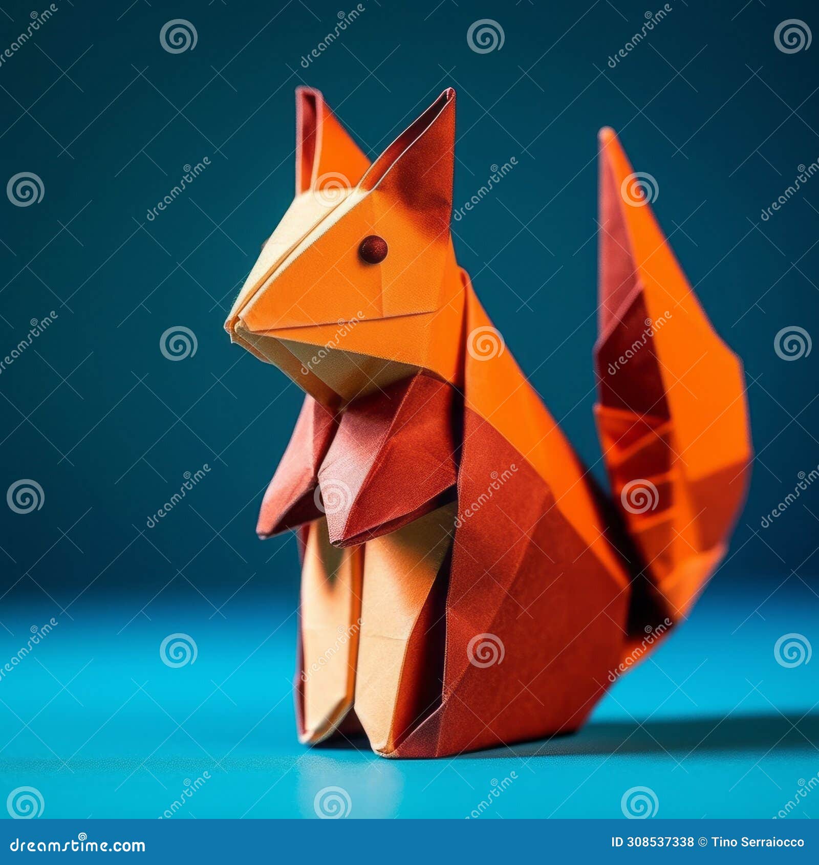 Origami Squirrel Crafted from Construction Paper Perched on Blue Table ...