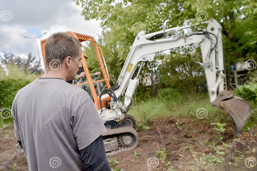Using digger in garden stock image. Image of shovel - 102050533