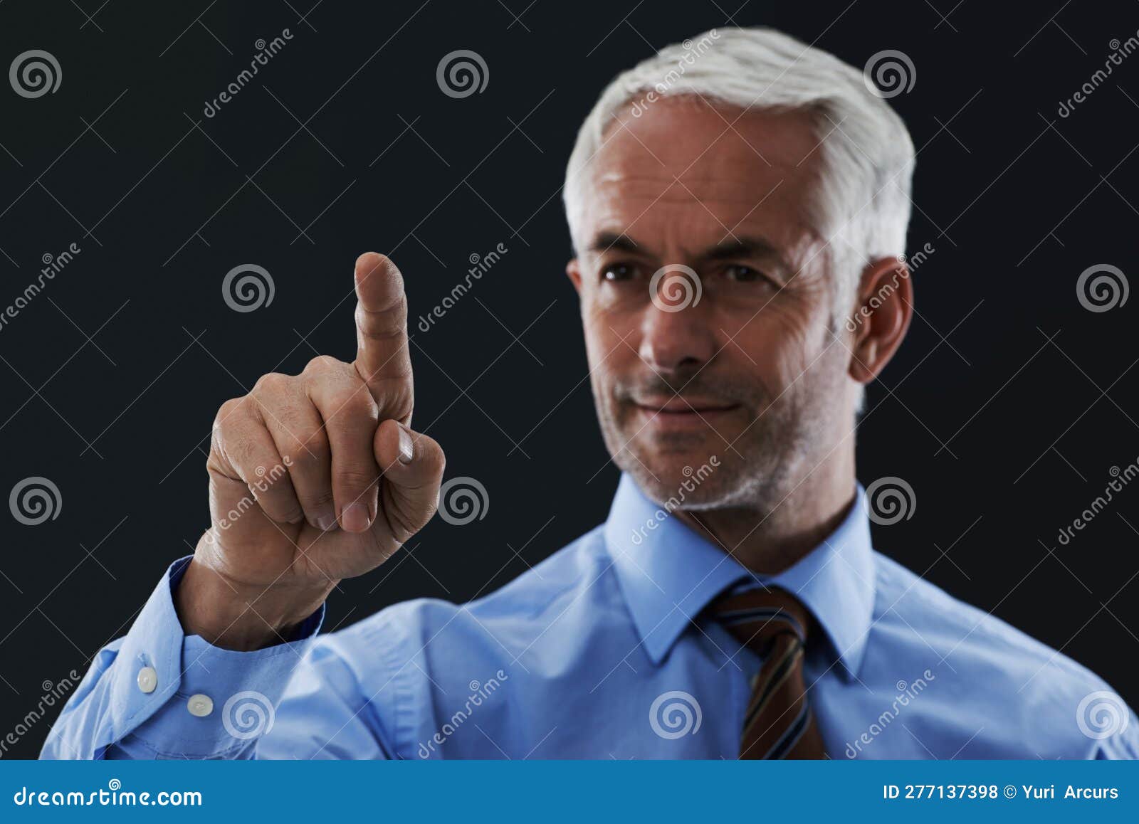 Using a Digital Interface. a Handsome Businessman Using a Digital ...