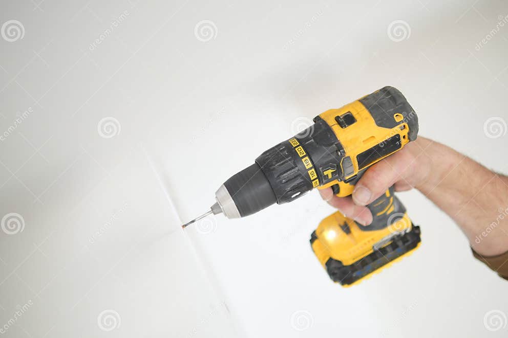 Using Electric Drilling on White Wooden Board Stock Photo - Image of ...