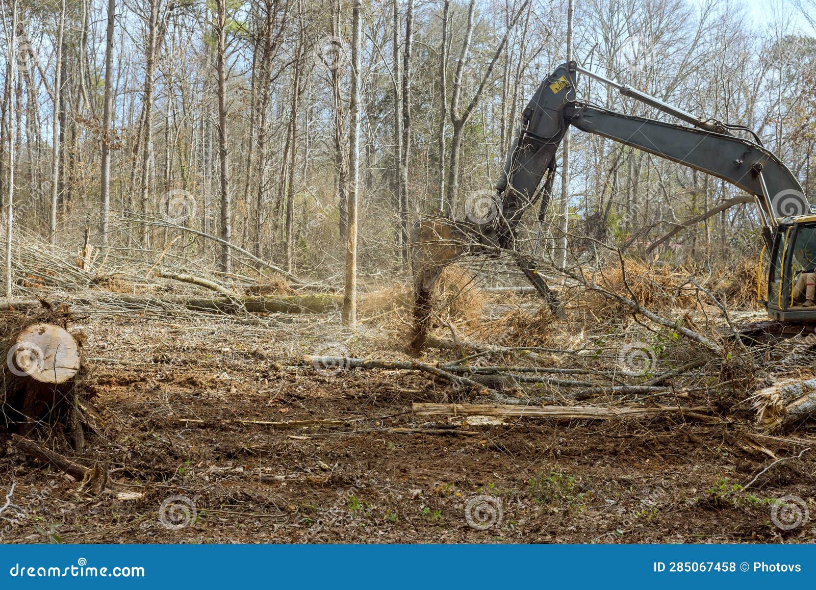 Using an Excavator Worker is Clearing Ground To Build a House. Stock ...