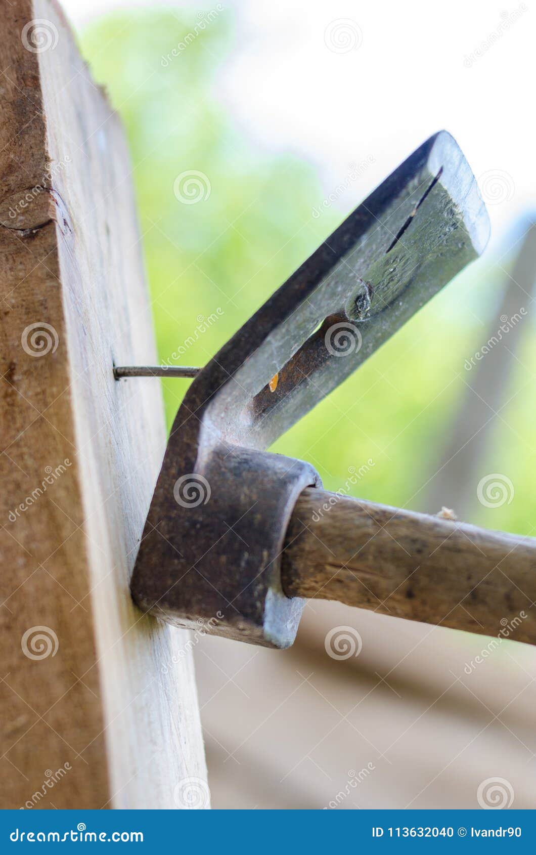 Using Hammer and Nail on Wood and Bokeh Background Stock Photo - Image ...