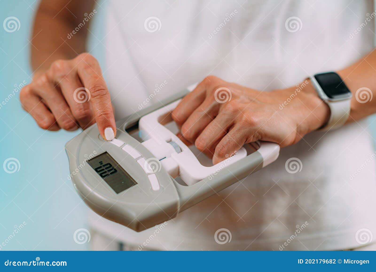 Using Hand Dynamometer for Grip Strength Test Stock Photo - Image of ...