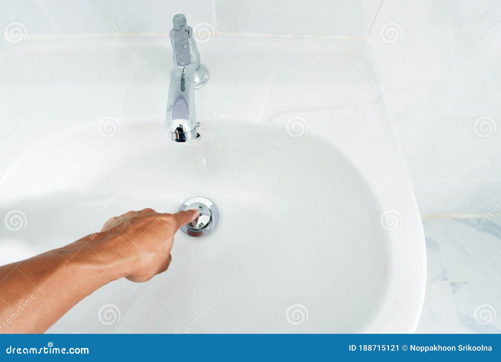 Using Hand is Press Button Water Drain of Basin Stock Image - Image of ...