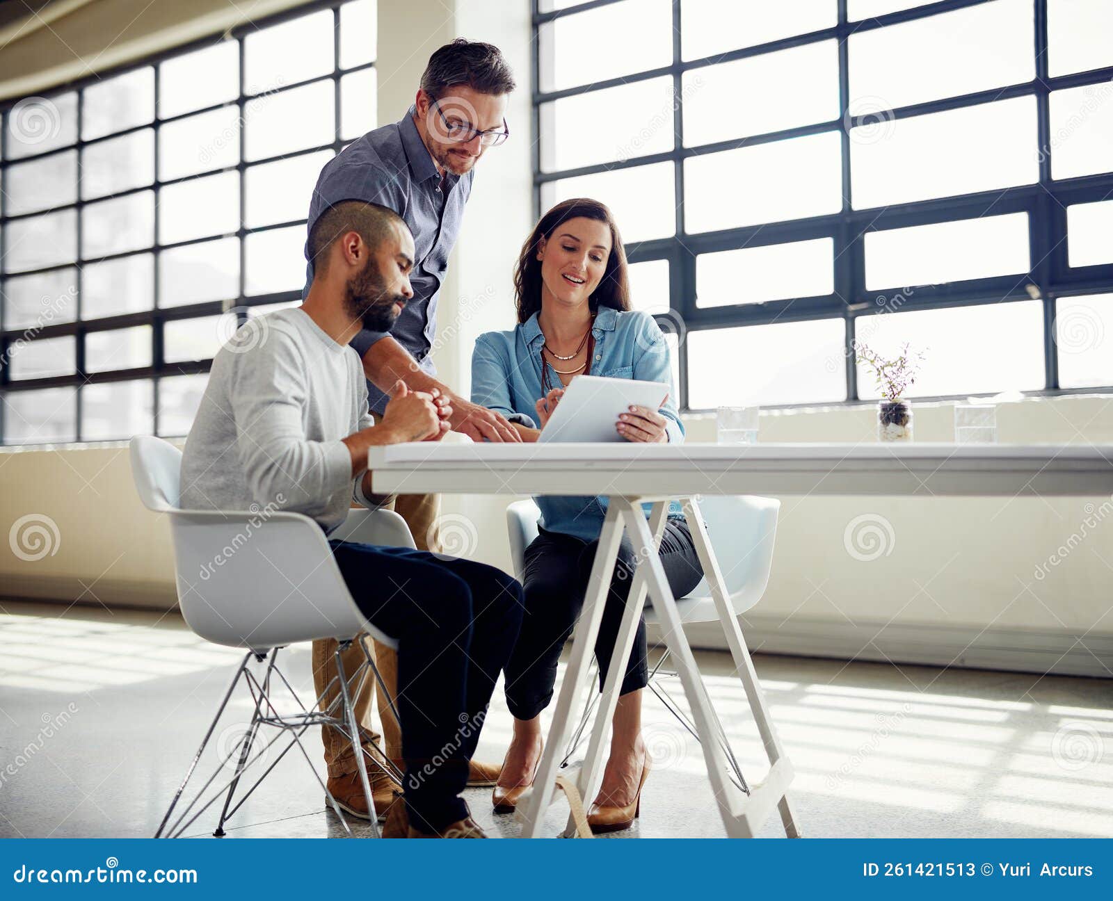 Using the Internet As a Reference. a Group of Designers Using a Digital ...