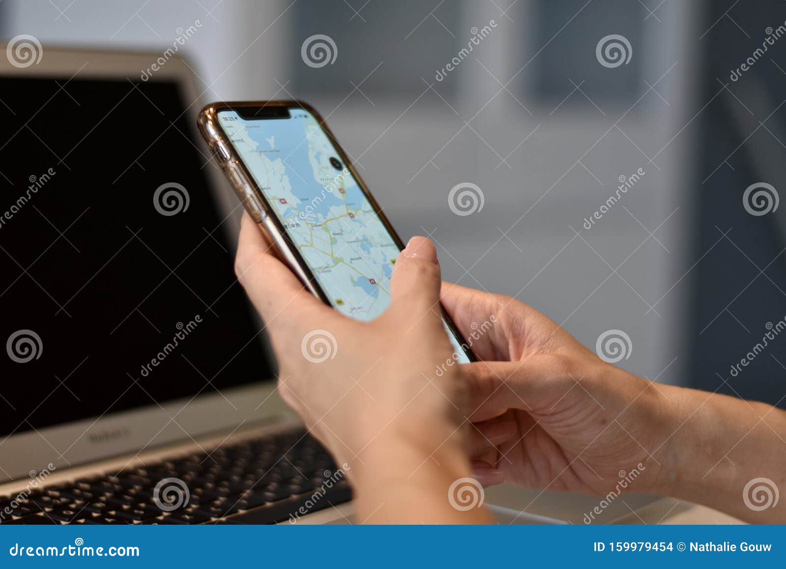 Using an Iphone To Look Up Directions Editorial Stock Image - Image of ...