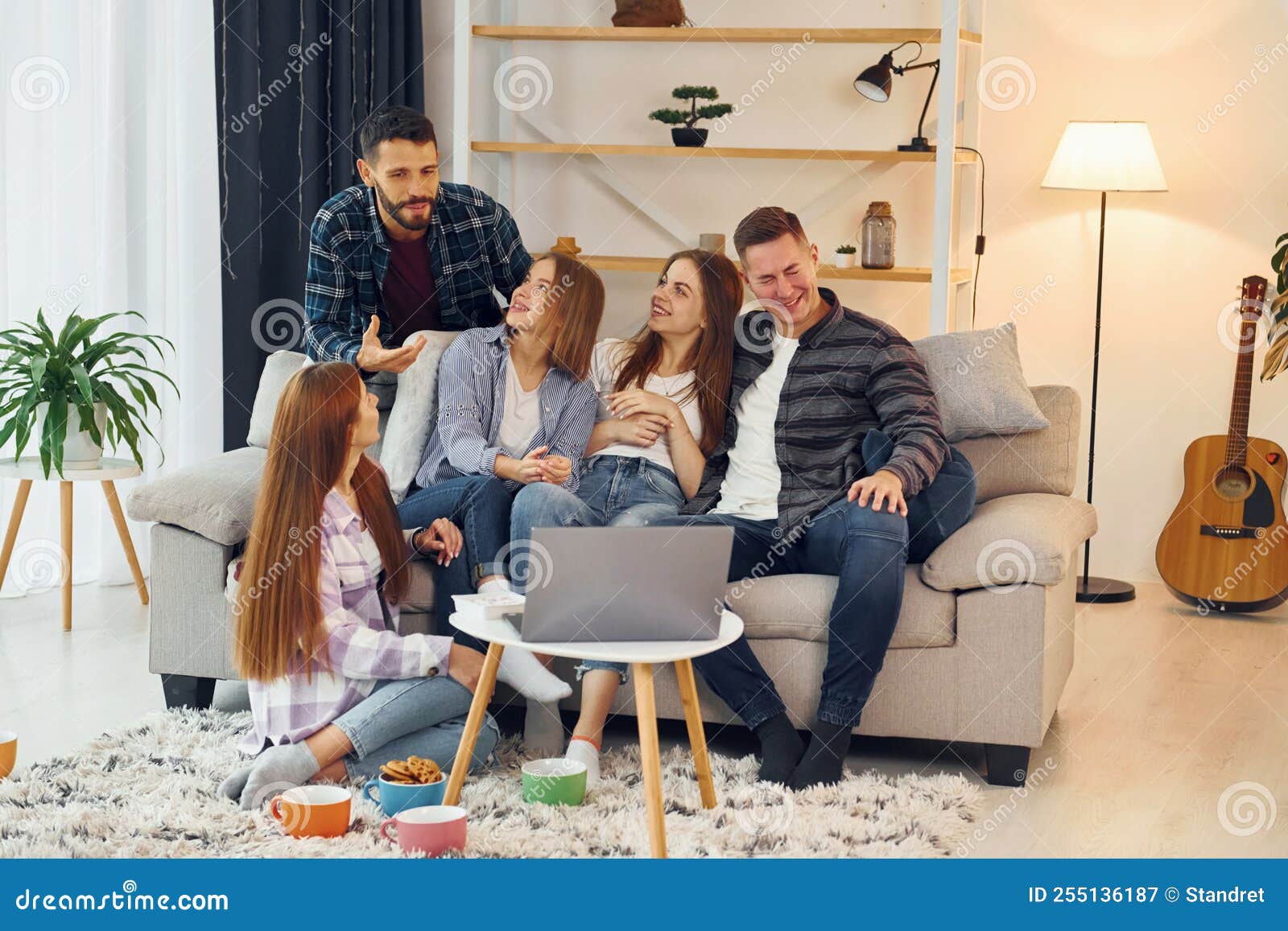 Using Laptop. Group of Friends Have Party Indoors Together Stock Image ...