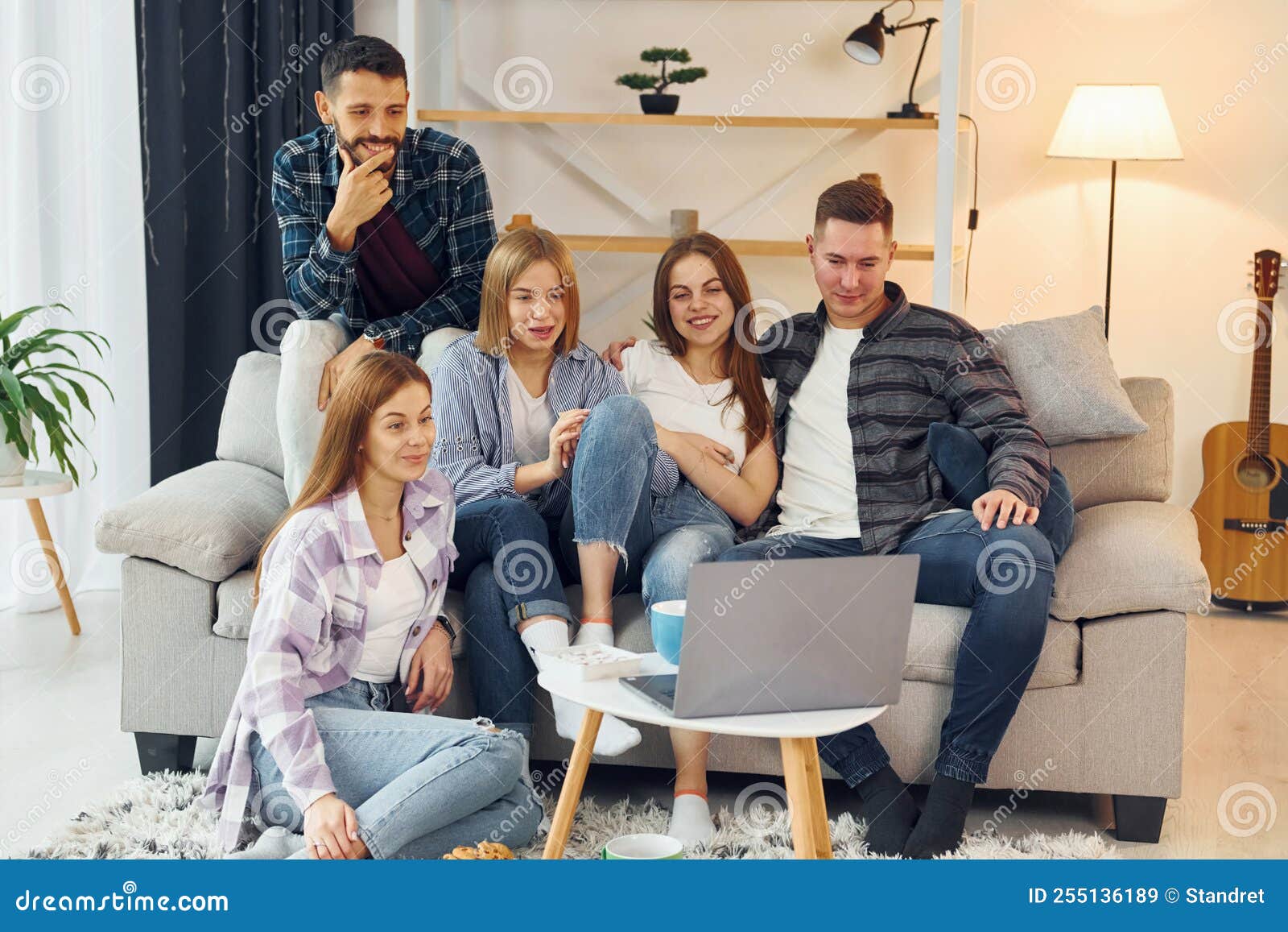 Using Laptop. Group of Friends Have Party Indoors Together Stock Image ...