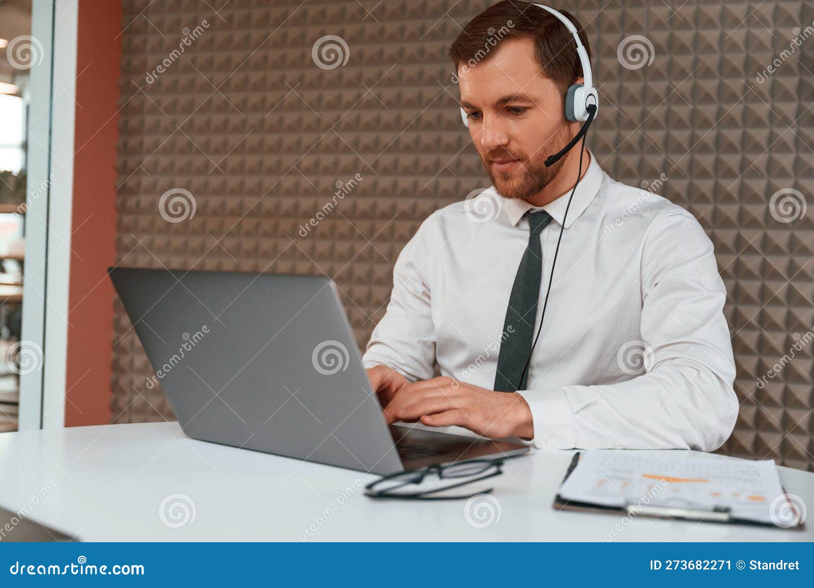 Using Laptop. Handsome Man in Formal Clothes is in the Office Stock ...
