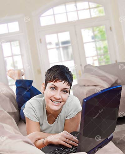 Using laptop at home stock image. Image of internet, casual - 2494621