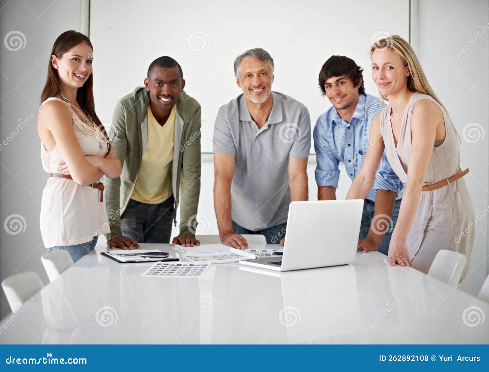 Using the Laptop To Their Advantage. Five Colleagues Using a Laptop in ...