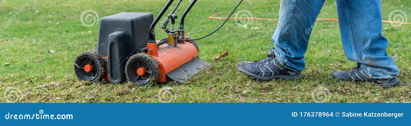 Using a lawn thatcher stock photo. Image of banner, mineral - 176378964