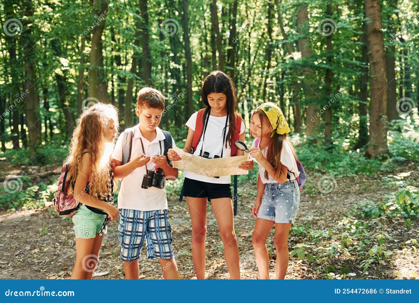 Using Map To Find a Way. Kids Strolling in the Forest with Travel ...