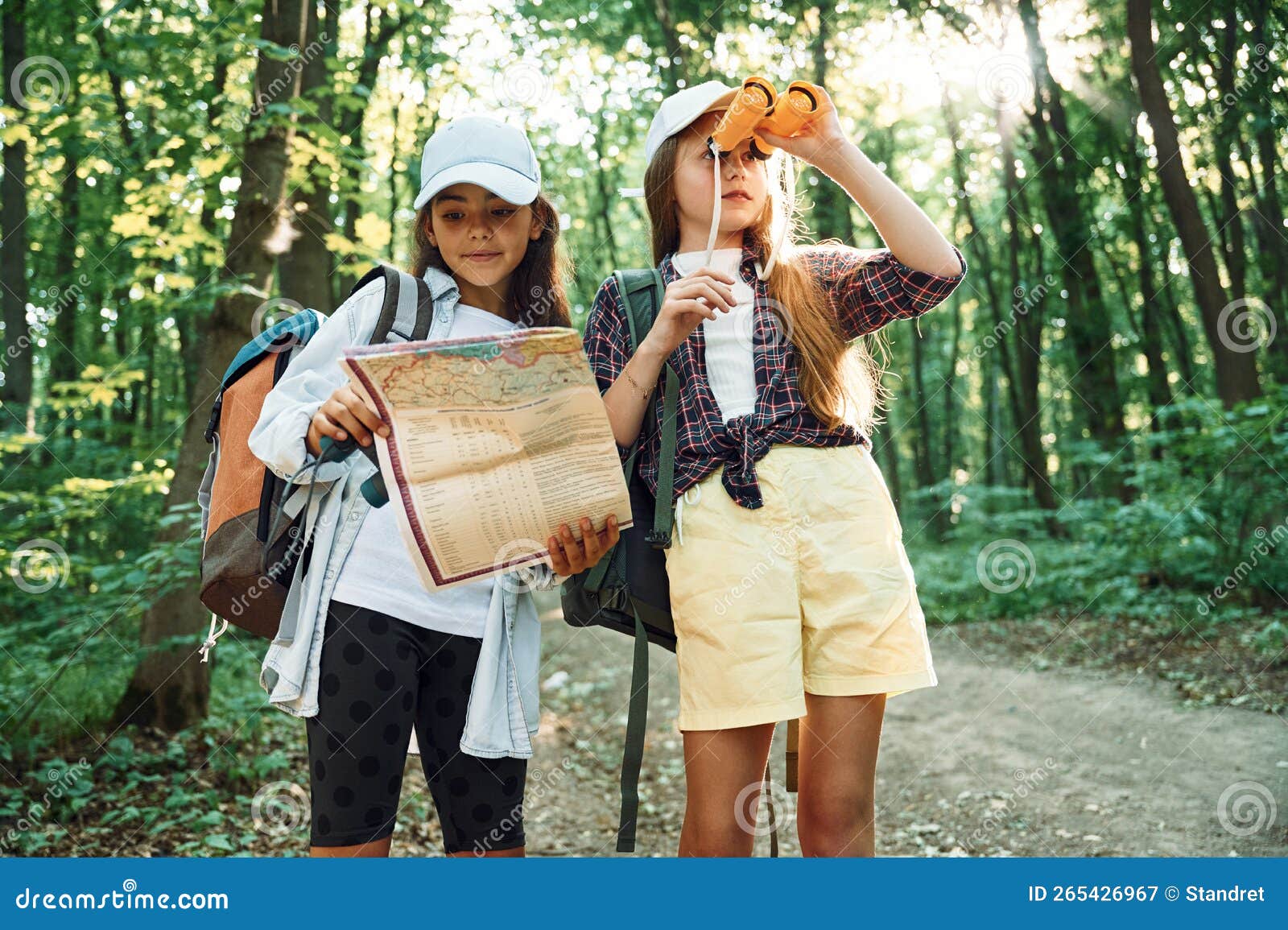 Using the Map. Two Girls is in the Forest Having a Leisure Activity ...