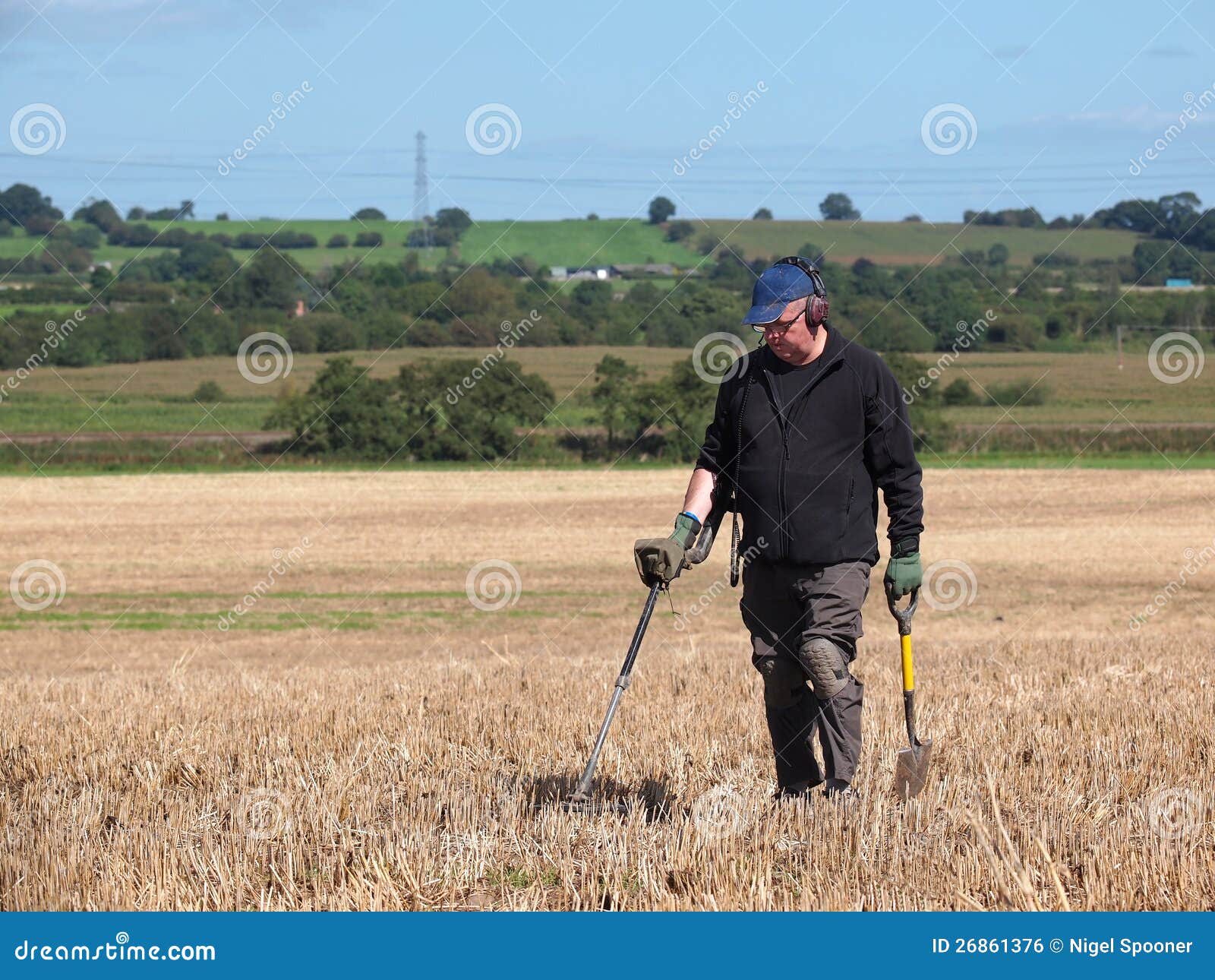 Using a Metal Detector in Field Stock Photo - Image of male, holding ...