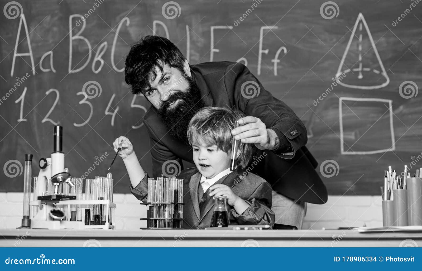Using Microscope in Lab. Father and Son at School. Student Doing ...
