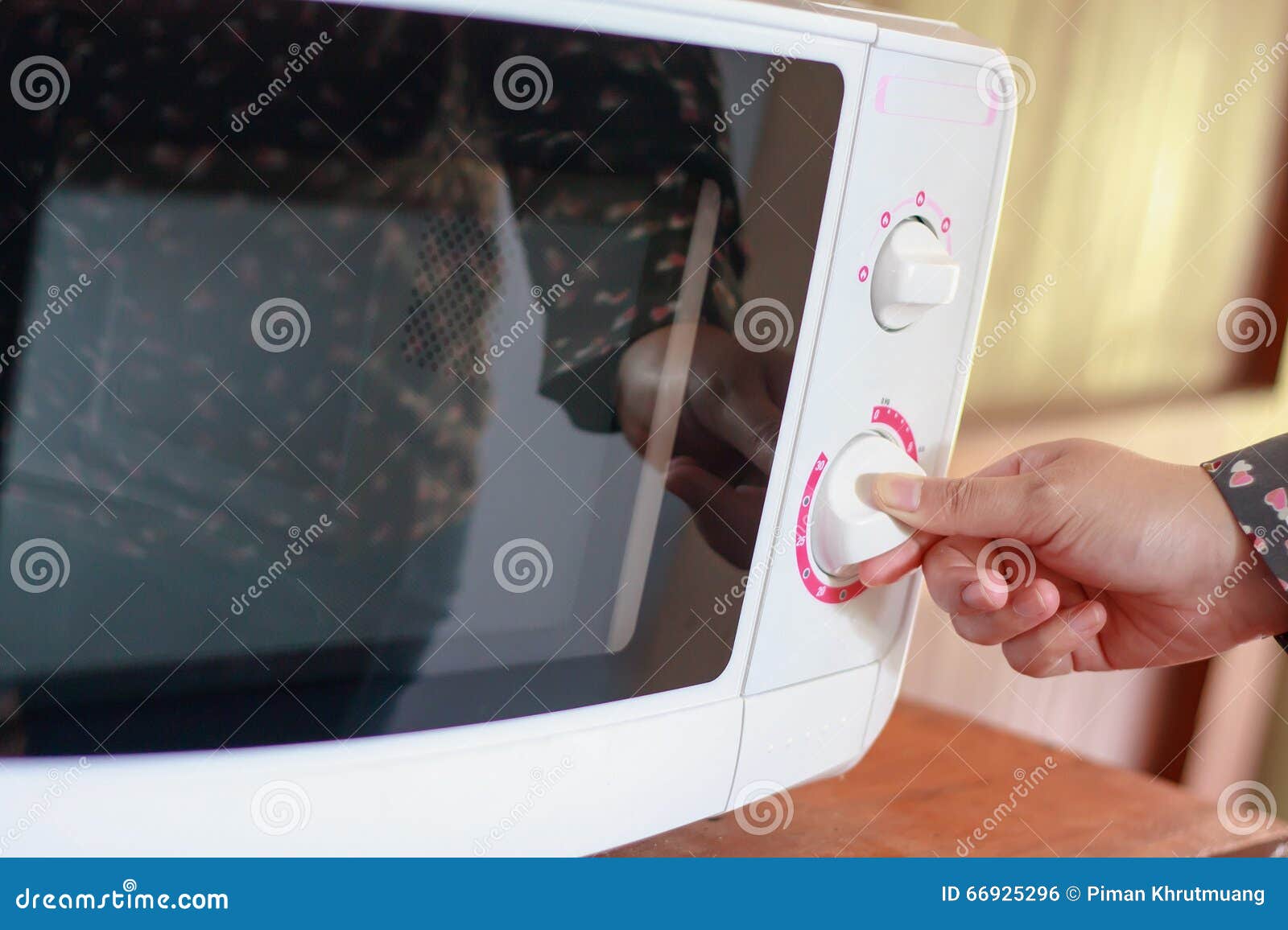 Using microwave oven stock photo. Image of technology - 66925296