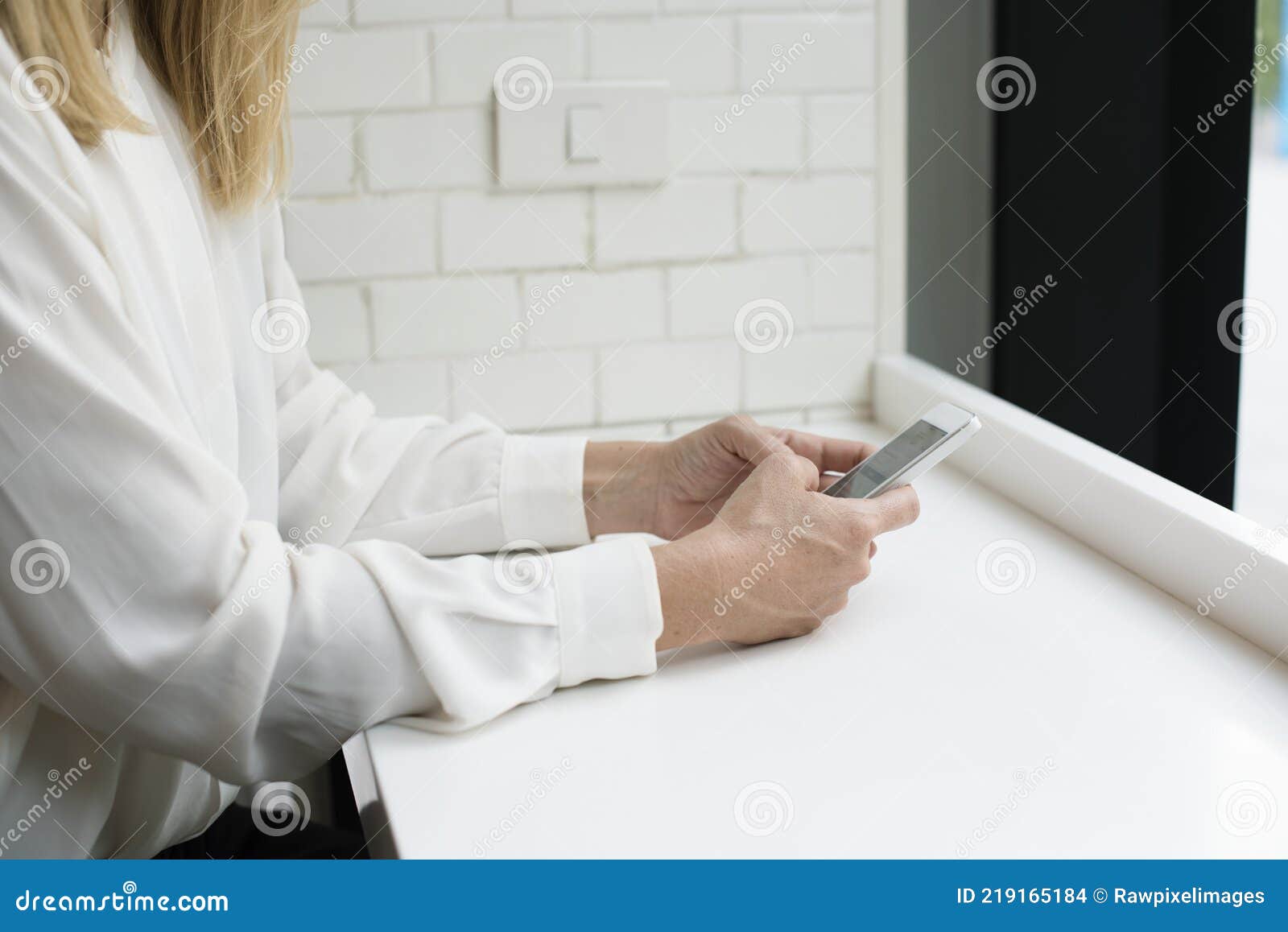 Using a Mobile Phone at the Desk Stock Photo - Image of chill, city ...
