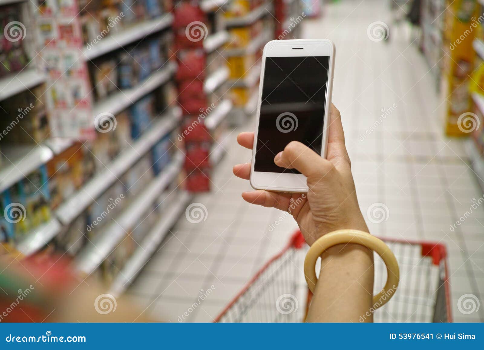 Using Mobile Phone in Market Stock Image - Image of mobile, phone: 53976541