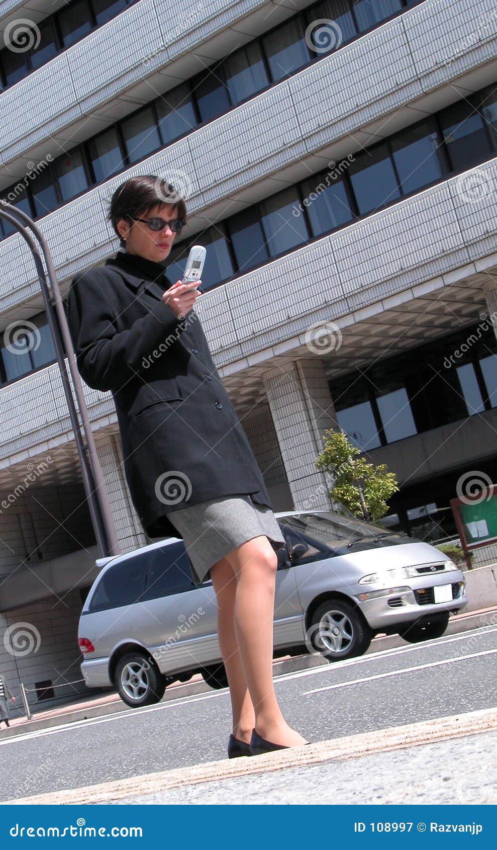 Using Mobile Phone in a Street Stock Image - Image of business ...