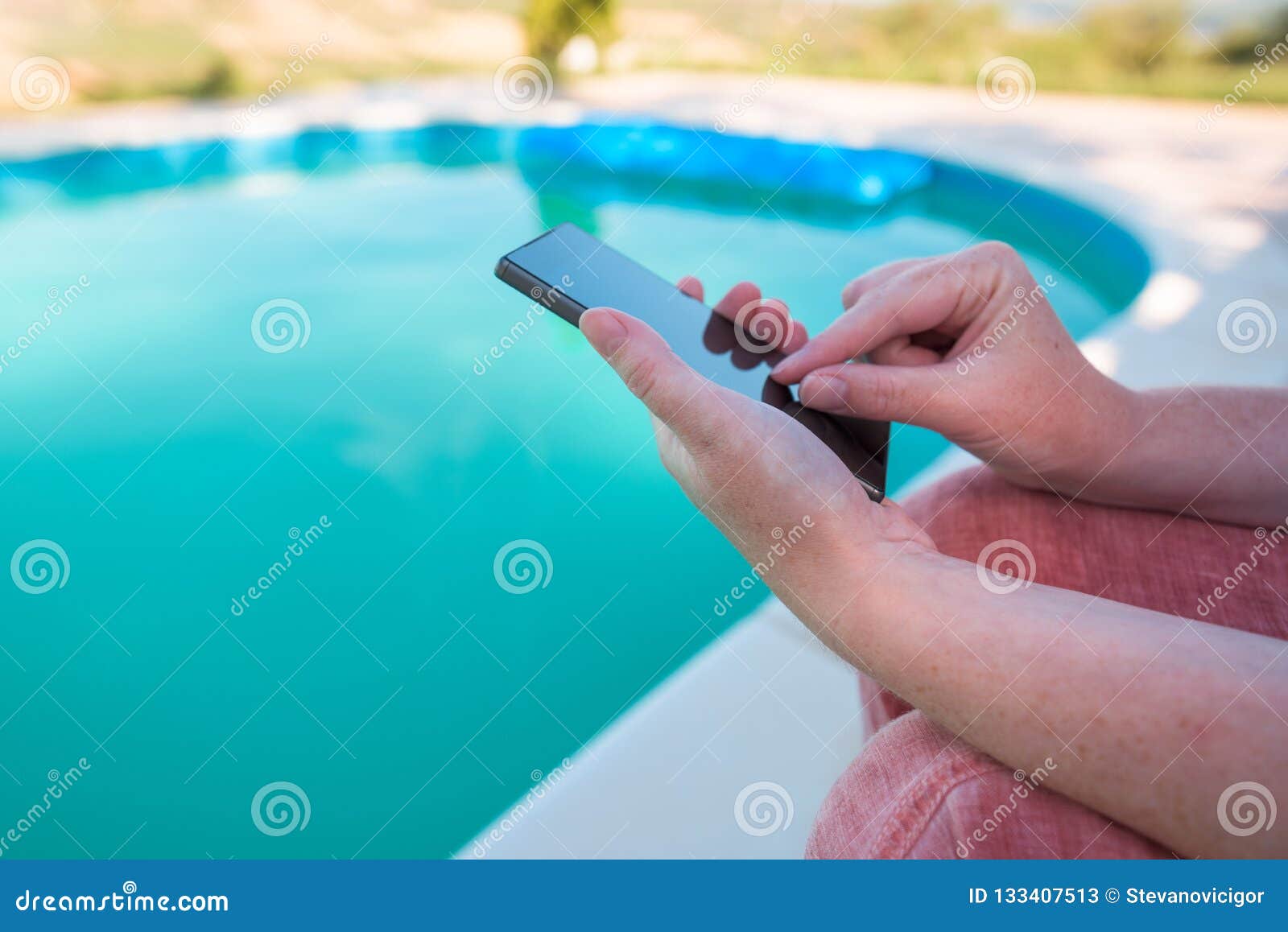 Using Mobile Phone by the Swimming Pool Stock Image - Image of blog ...