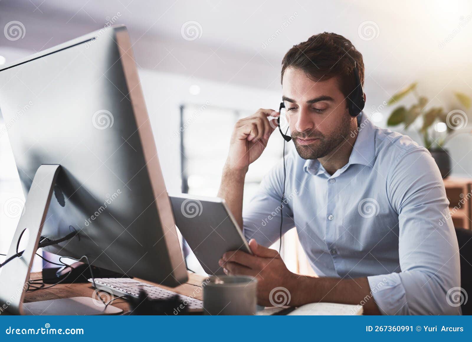 Using Multiple Devices To Resolve the Issue at Hand. a Young Call ...