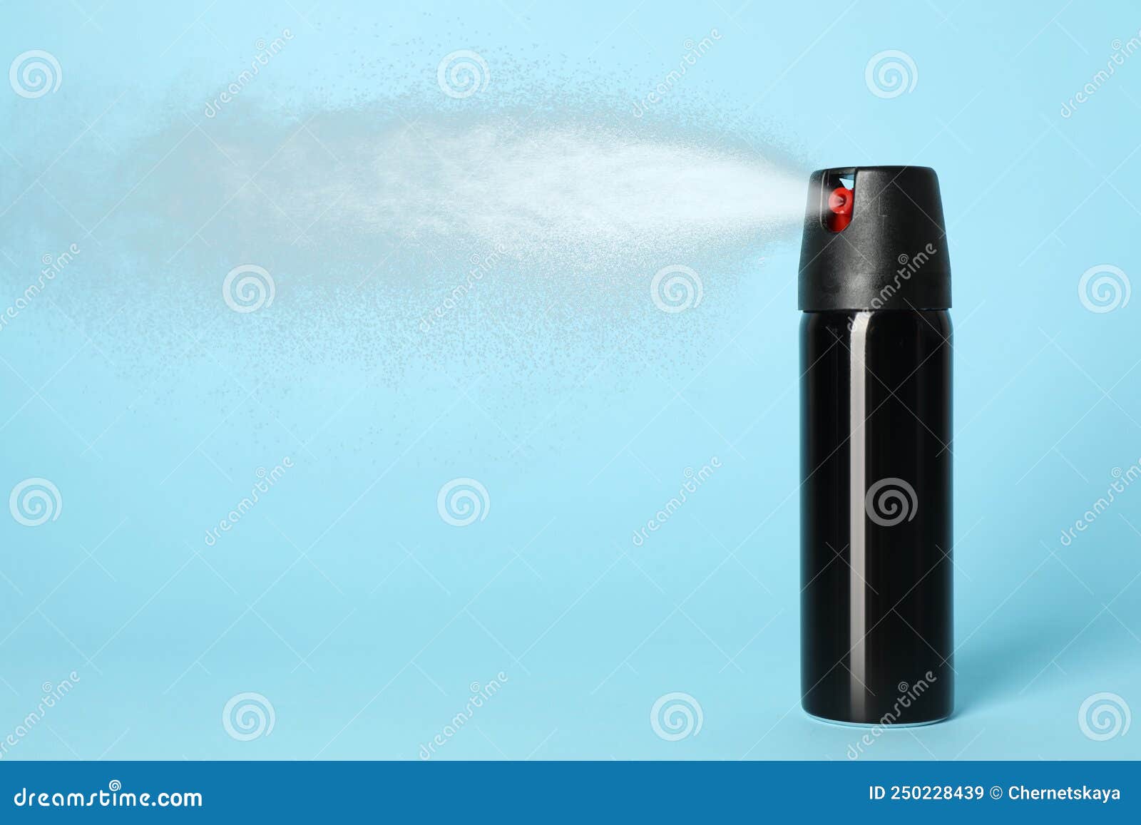 Using of Pepper Spray on Light Blue Background Stock Image - Image of ...